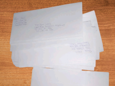 Handwritten 500 index card and envelopes in neat handwriting, mailed to ...