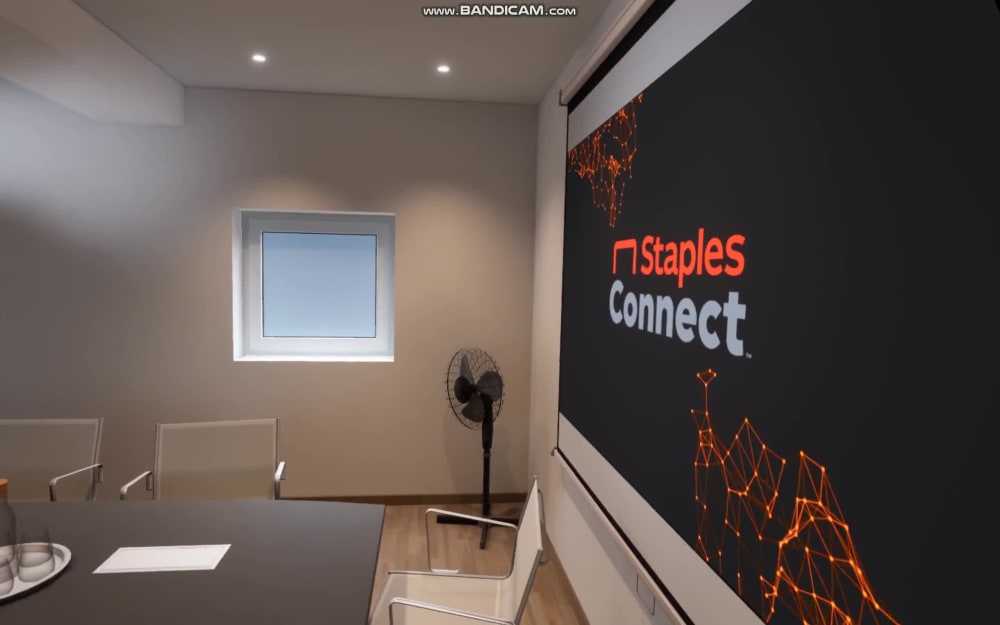 An interactable office environment with company video playing in ...