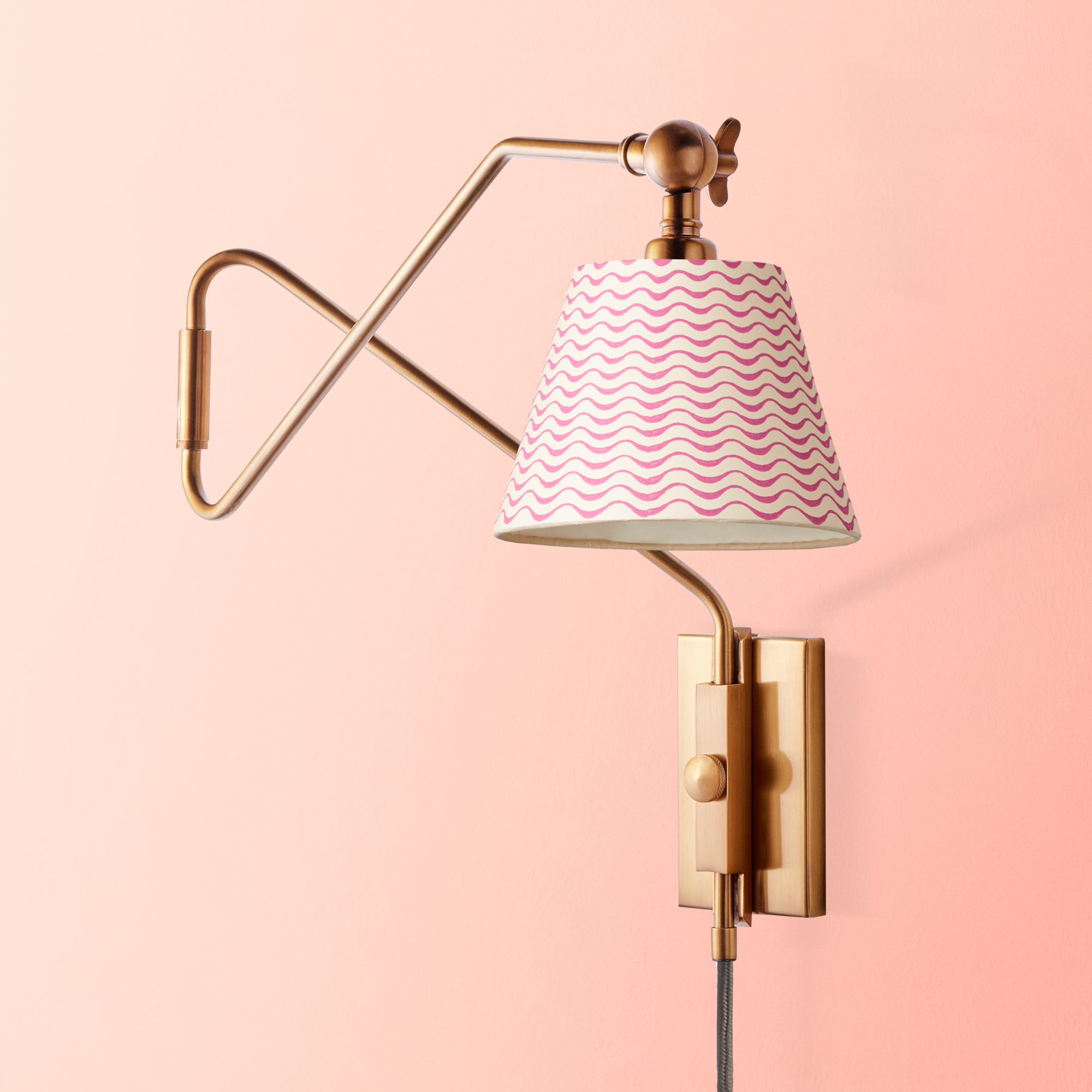 Cooper Wall fixture in antiqued Brass
