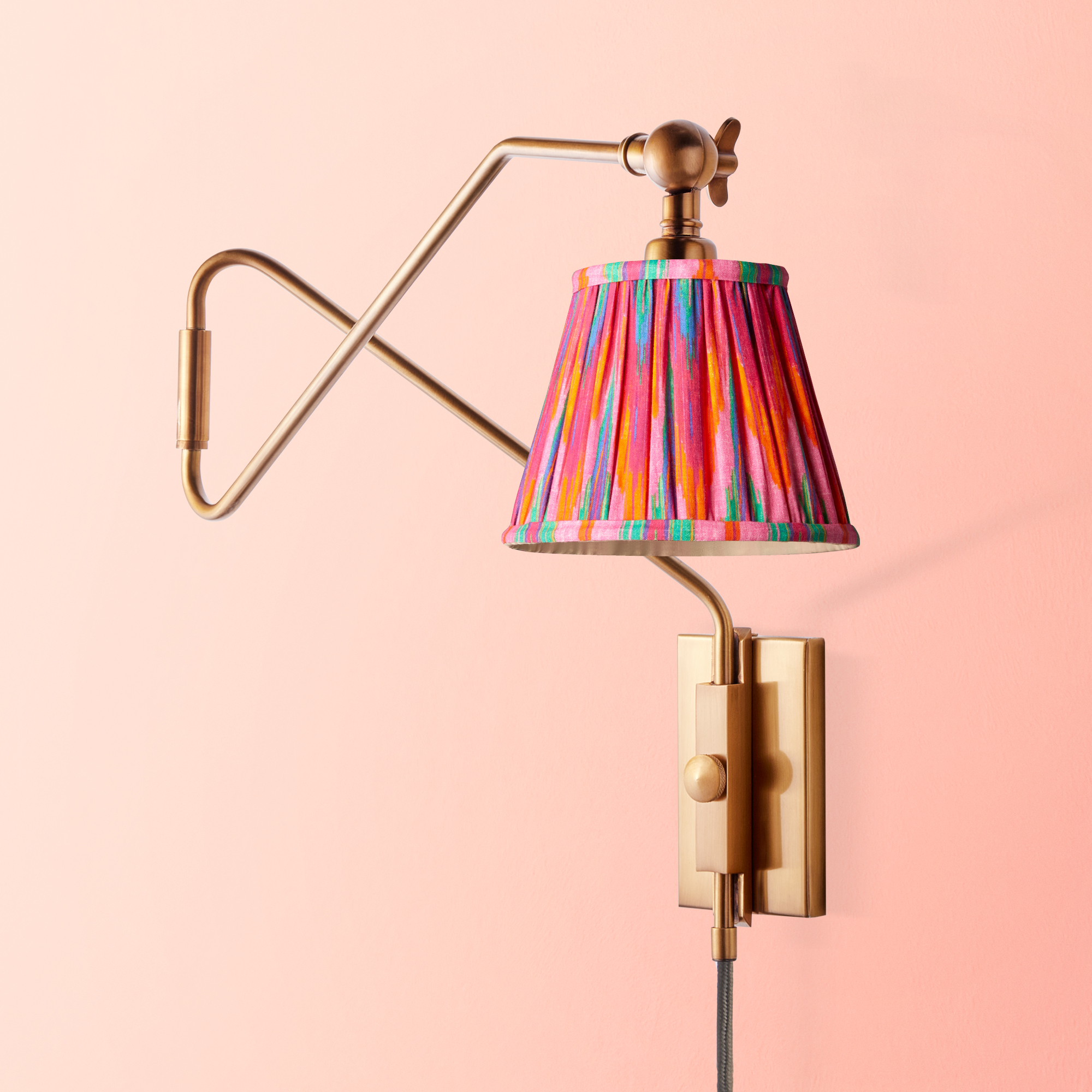 Cooper Wall fixture in antiqued Brass