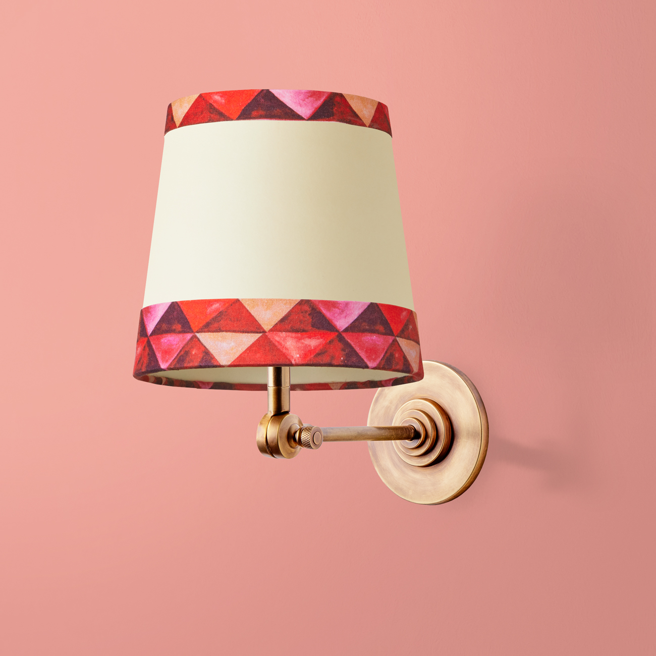 Elbow cordless wall fixture in antique brass
