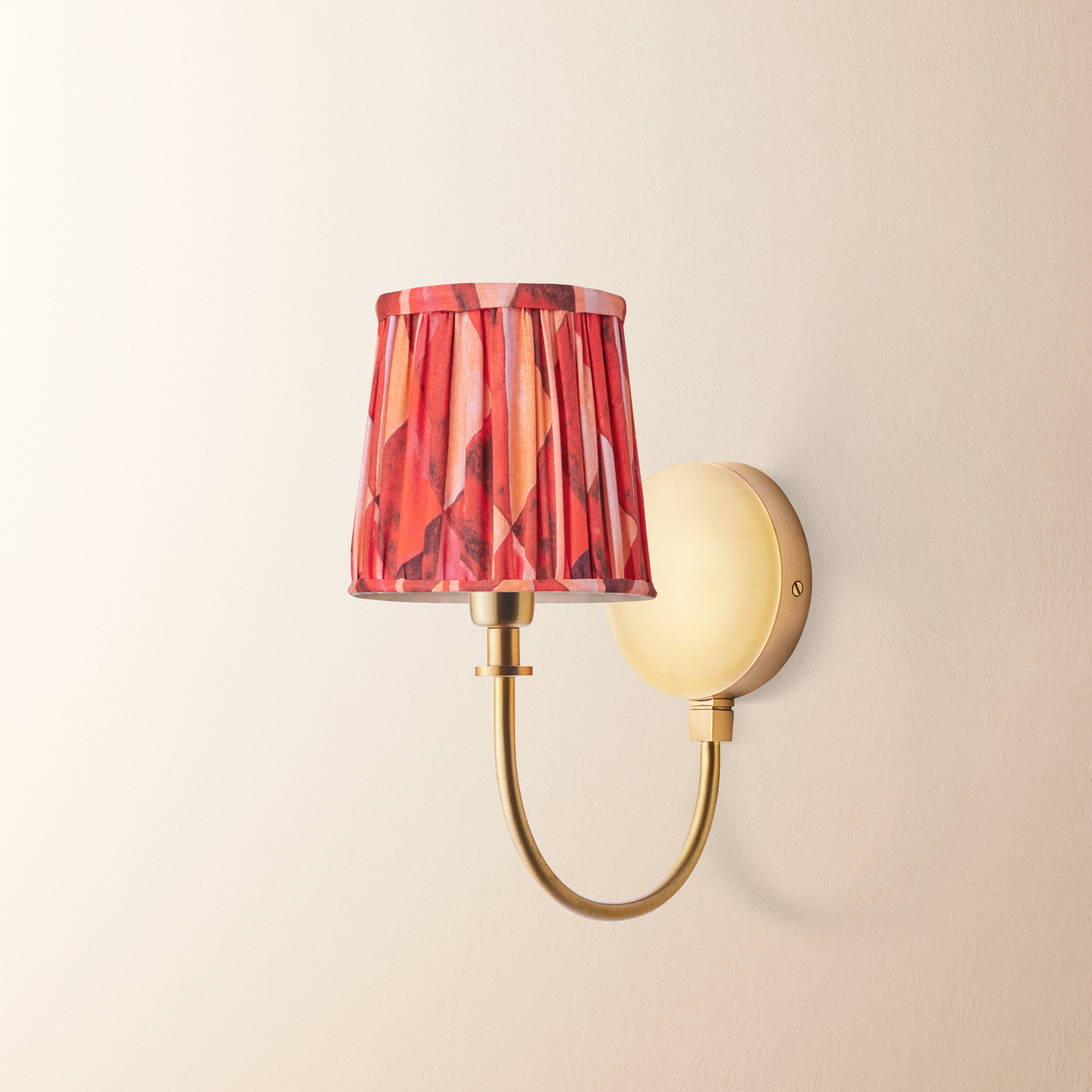 Gramma wall fixture in antiqued brass
