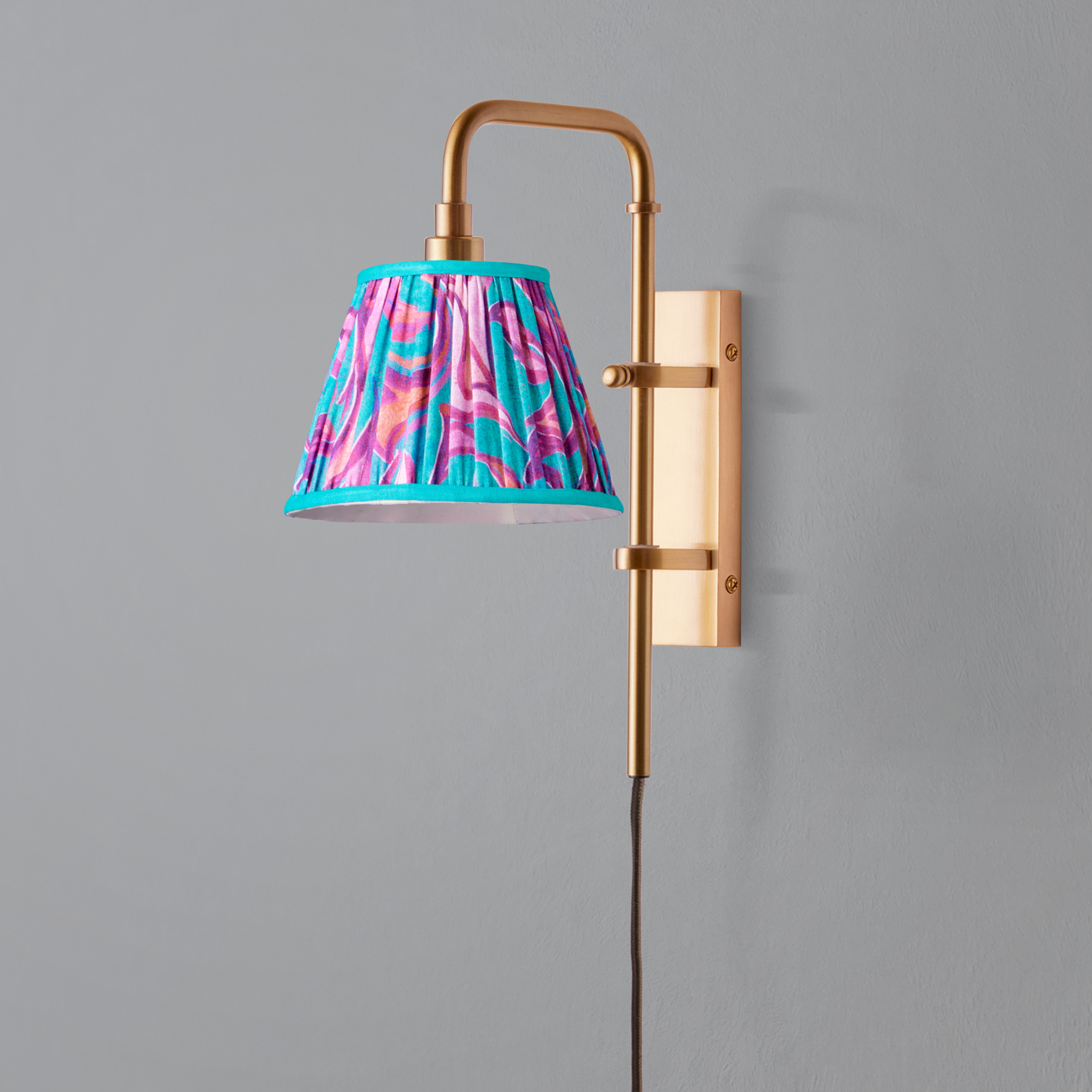 Tiree wall fixture in antiqued brass with external flex in olive green