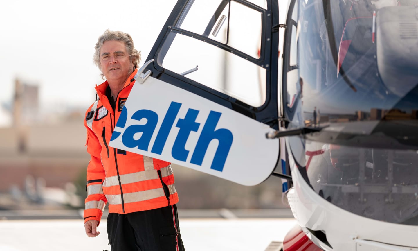 UW Med Flight physician Michael Abernethy next to the helicopter