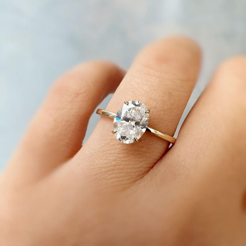 Hidden Ruby Heart Oval Moissanite Solid Yellow Gold Ring | Azura ...