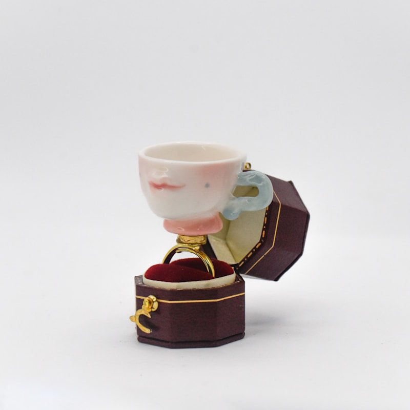 The Kissing Cup Spinning Mini Porcelain Cup Ring | H2 Studio | Wolf ...
