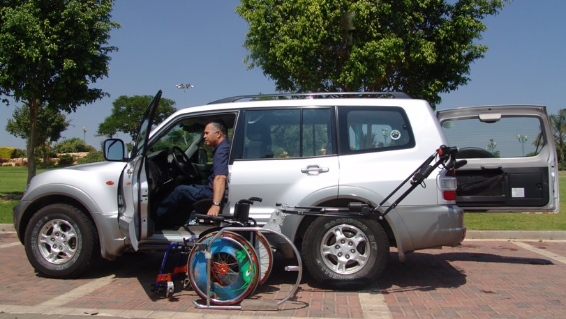 TMN's R11 Robot for automatic wheelchair storage in the vehicle's boot
