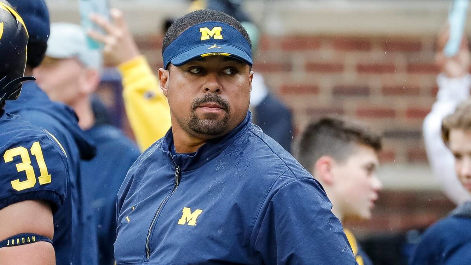 Michigan asst. Mike Hart carted off after collapsing on sideline ...