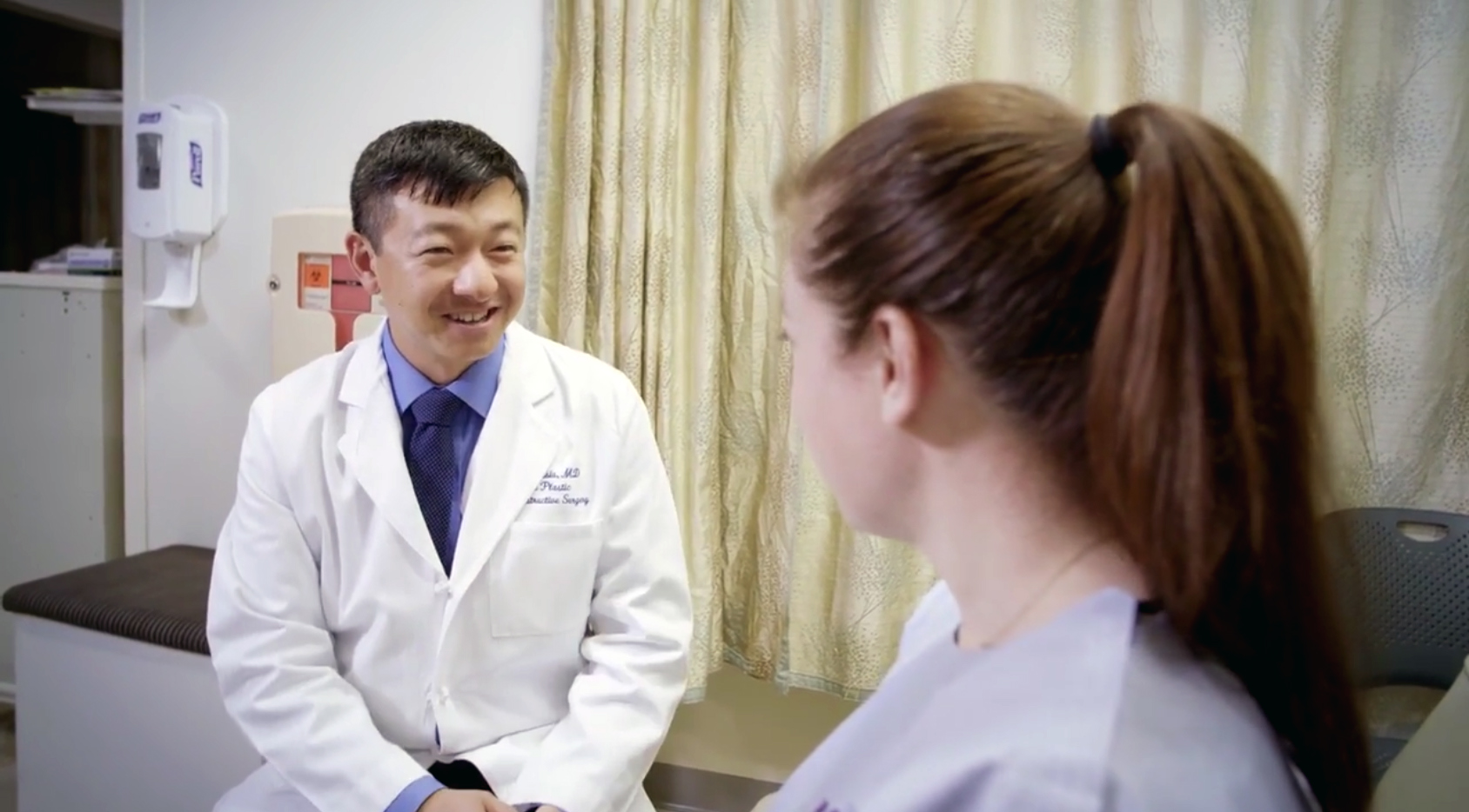 Dr. Henry Hsia speaks to a patient.